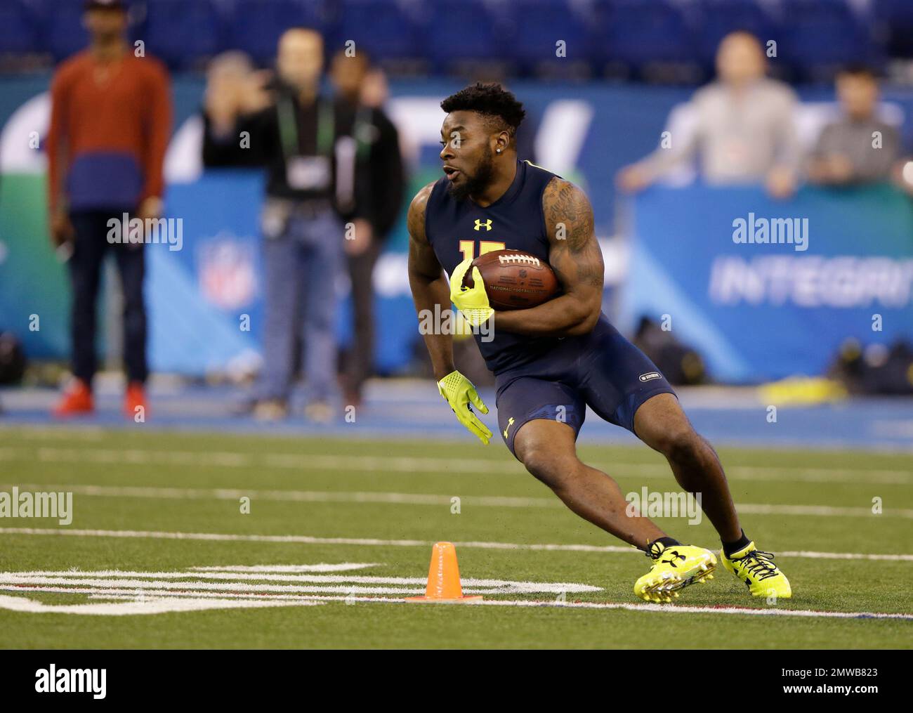 North Carolina running back T.J. Logan runs a drill at the NFL football ...