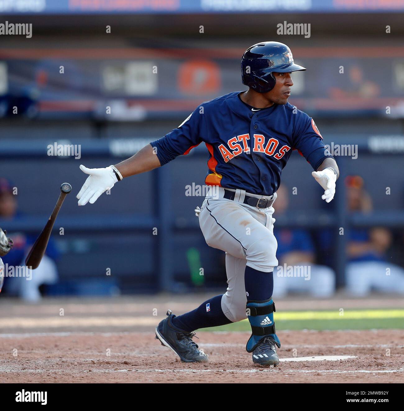 Houston Astros' Tony Kemp (18) follows through with a base hit in the ...