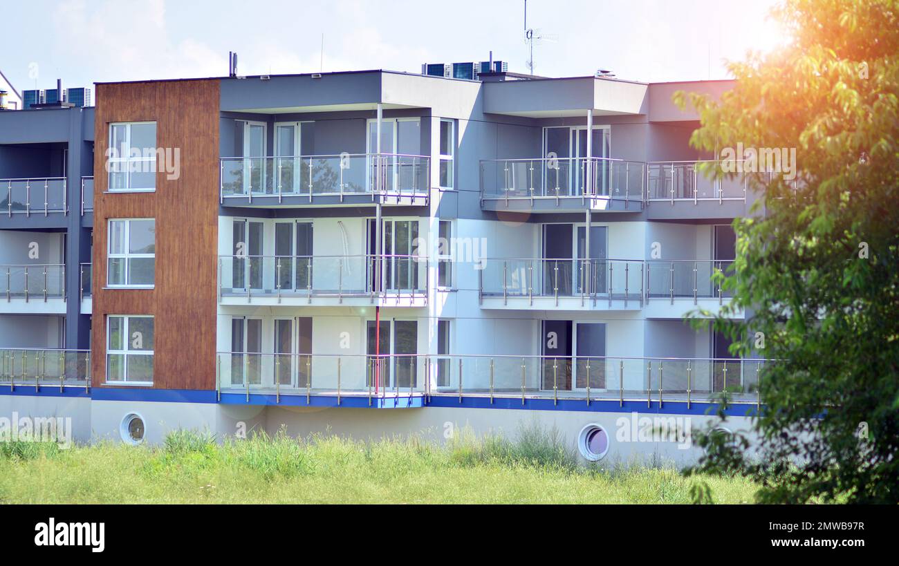 Modern residential building with new apartments in a green residential ...
