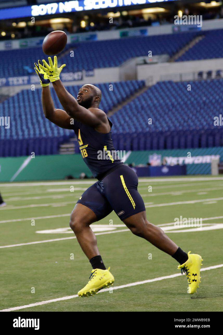 LSU running back Leonard Fournette runs a drill at the NFL football ...