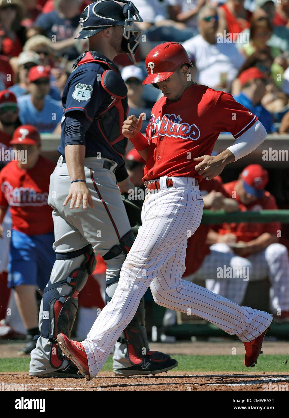 Philadelphia Phillies' Cesar Hernandez scores in front of Minnesota ...