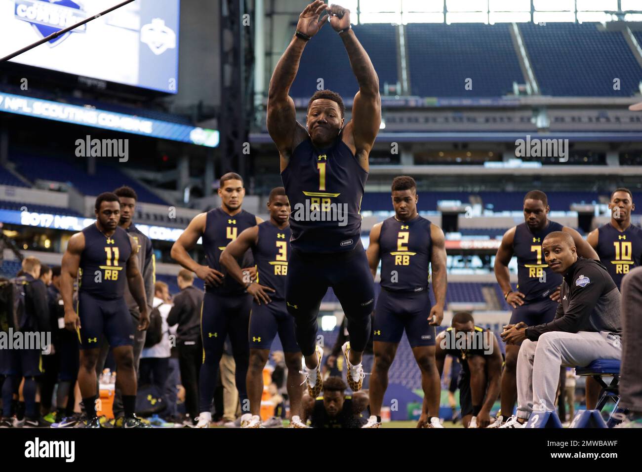 Oklahoma State running back Christopher Carson is tested in the broad ...
