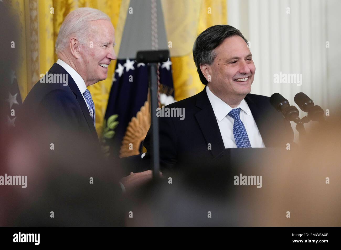 President Joe Biden listens during an event to thank outgoing White ...