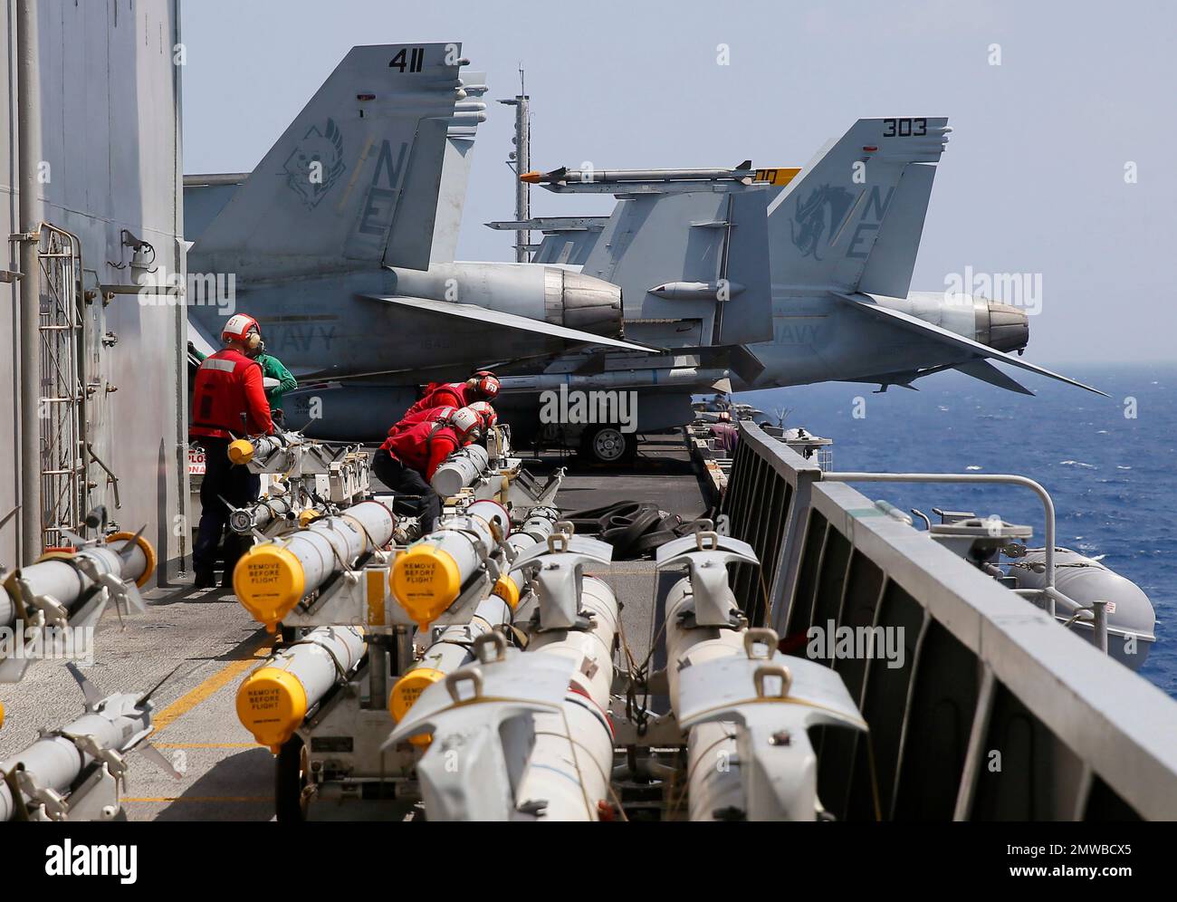 U.S. Navy crewmen from the U.S. Navy aircraft carrier USS Carl Vinson ...