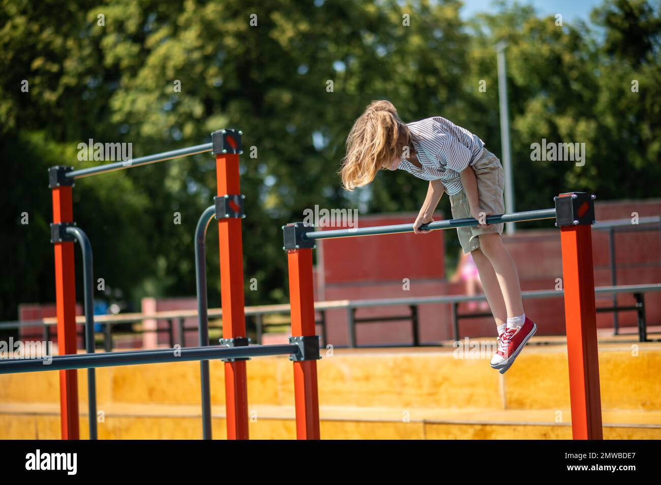 Fit boy performing a strength training exercise outdoor Stock Photo - Alamy