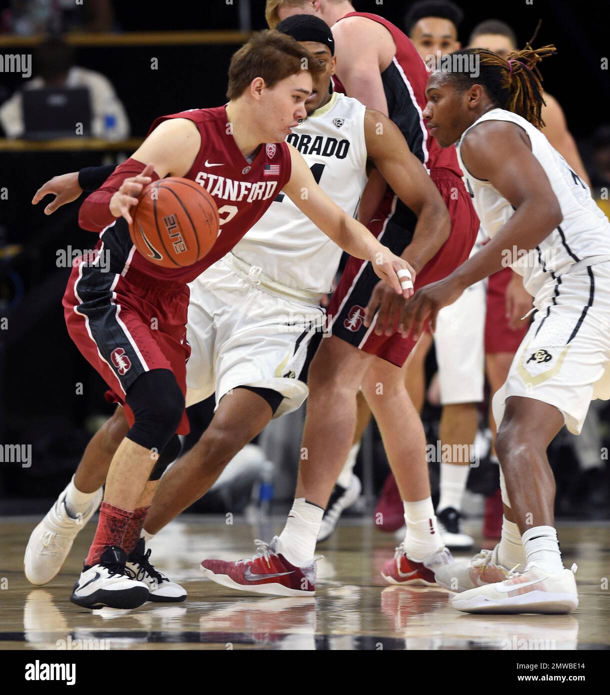 Stanford's Robert Cartwright, left, drives on Colorado's George King ...