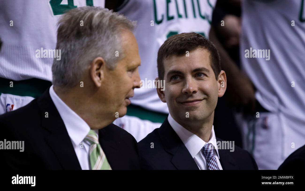 Boston Celtics head coach Brad Stevens, right, sits with general manager Danny Ainge before an ...