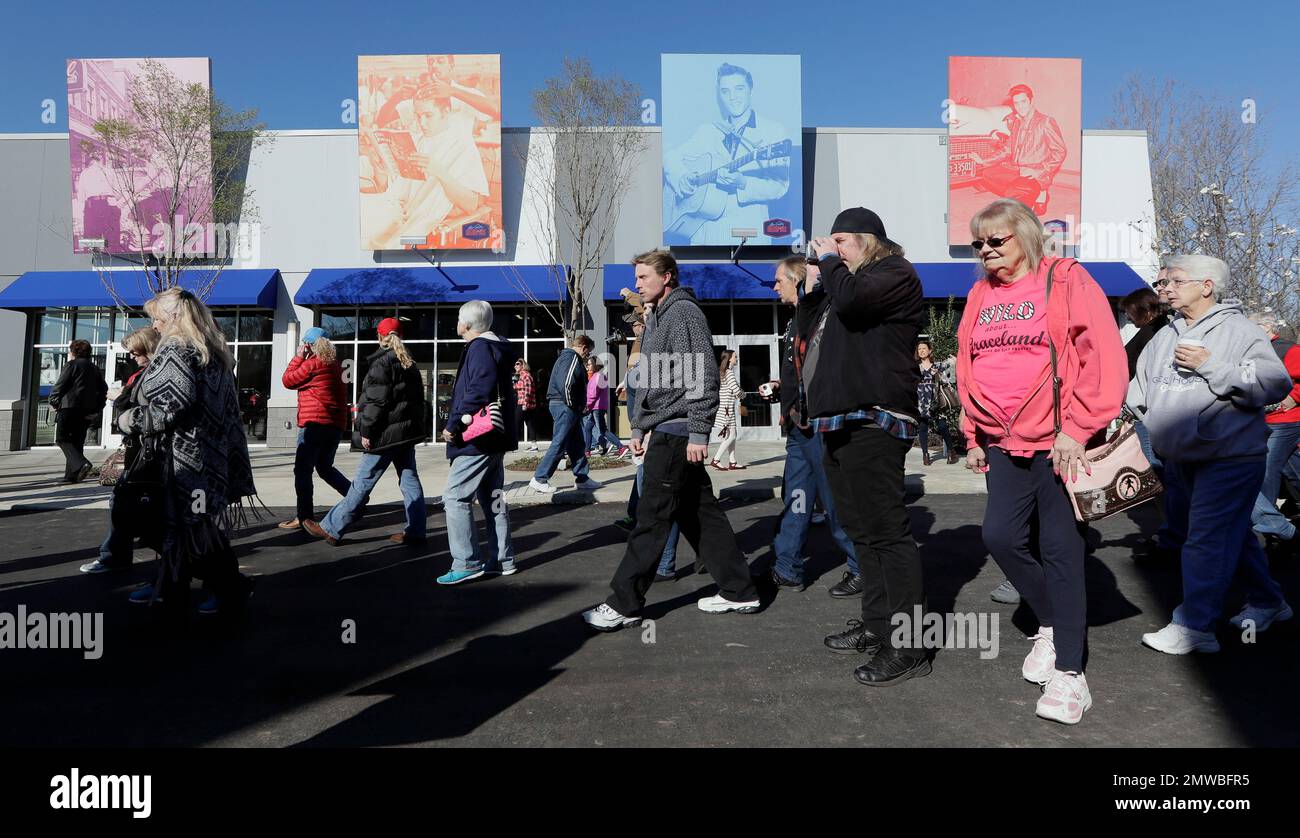 Elvis Presley fans enter the "Elvis Presley's Memphis" complex Thursday ...
