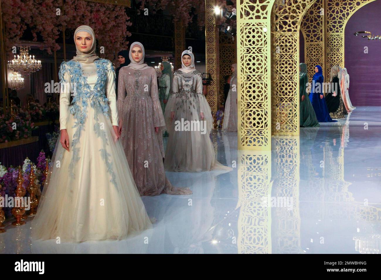 In this photo taken Wednesday, March 1, 2017, models present creations ...