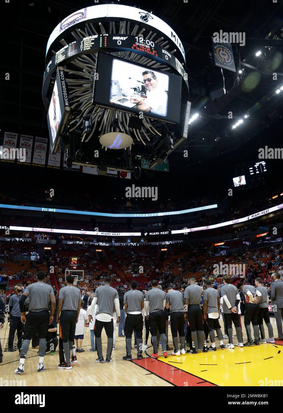 Miami Heat players stand for a moment of silence in honor of Hector ...