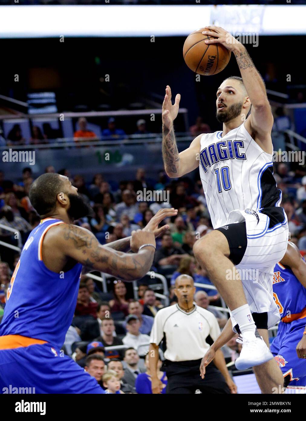 Orlando Magic's Evan Fournier (10) goes up for a shot over New York ...
