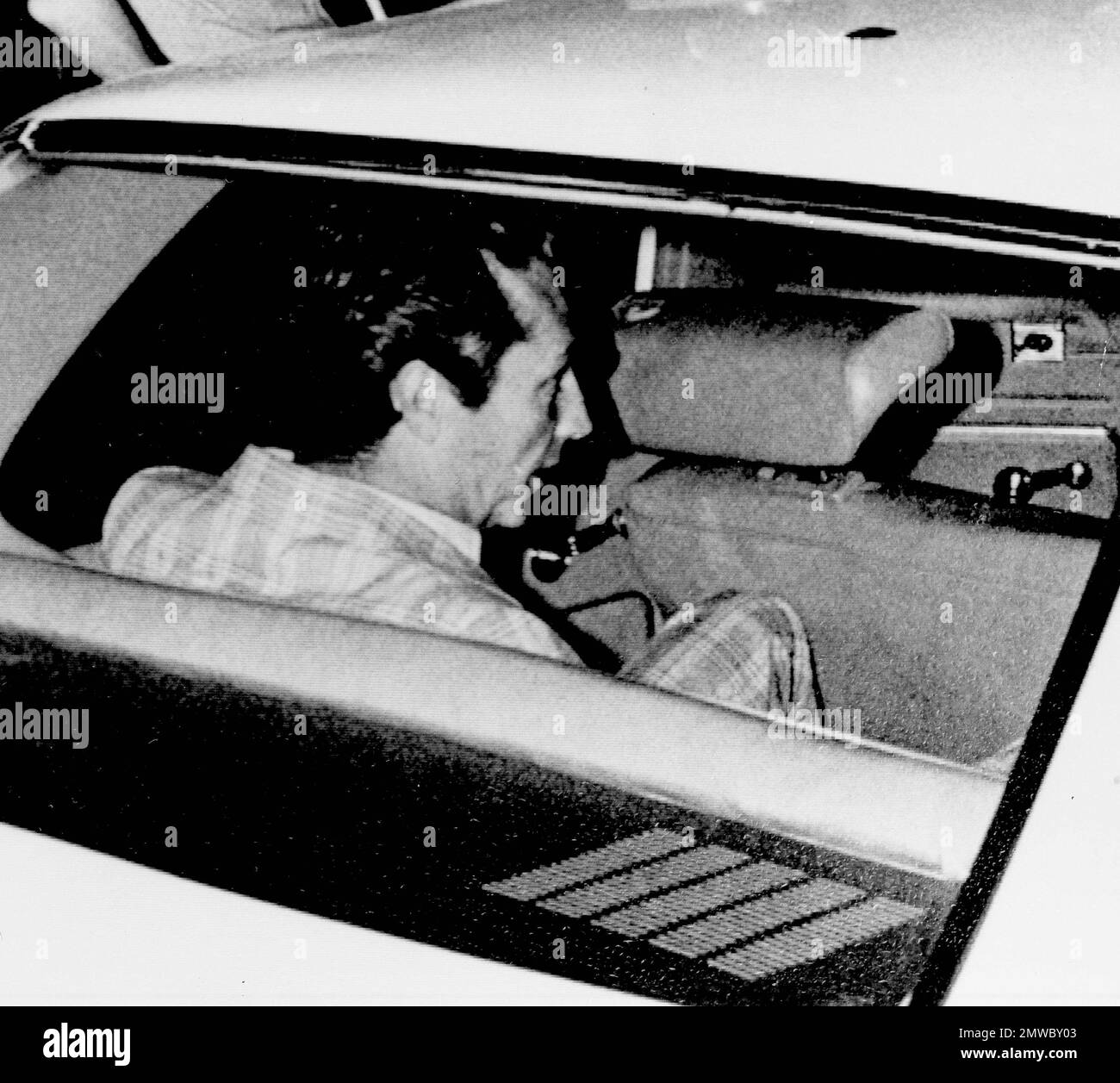 T. Cullen Davis is shown in the back of a police car after he ...