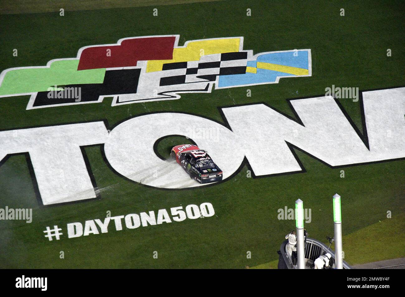 Kurt Busch (41) spins out on the grass in front of the grandstands ...