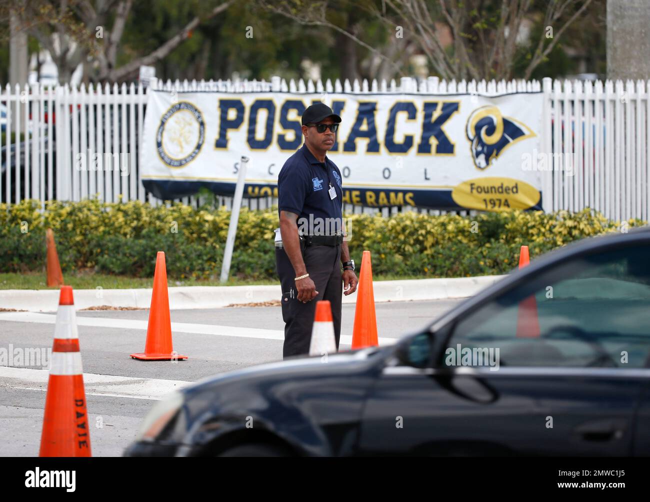 A security guard stands outside the entrance to the David Posnack ...