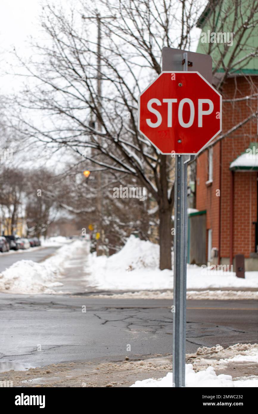 Stop sign in a residential neighborhood at crossroads in winter Stock ...