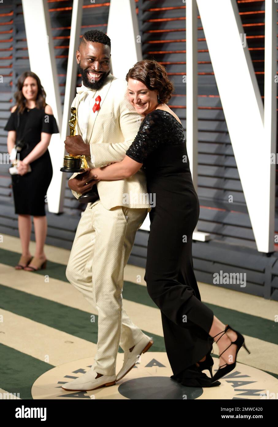 Tarell Alvin McCraney, left, and Adele Romanski arrives at the Vanity ...