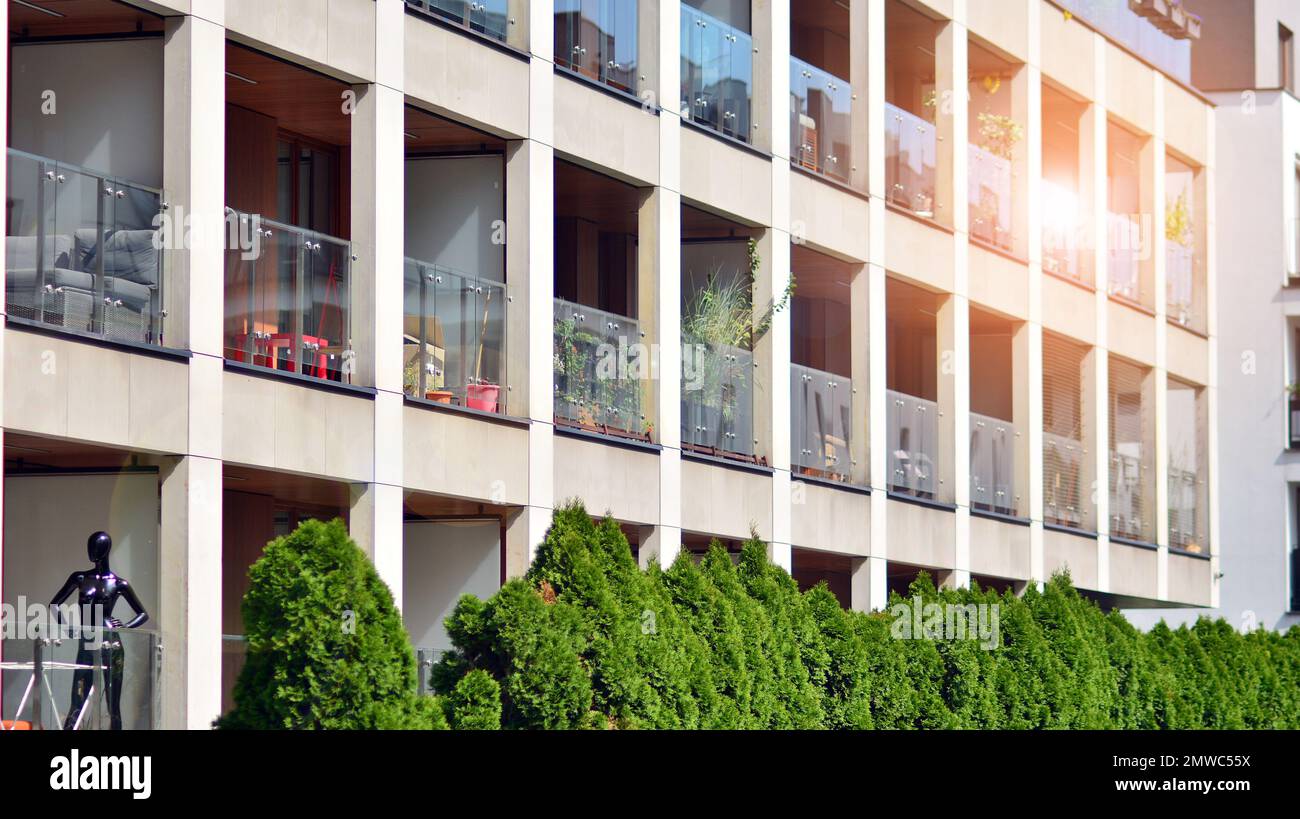 Modern white facade of a residential building with large windows. View ...