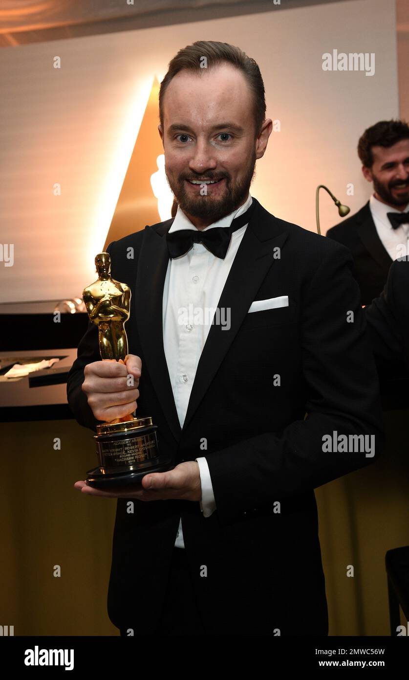 Andy Wright poses with the award for best sound mixing for "Hacksaw ...