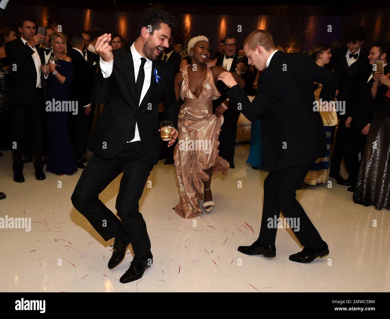 Dominic Cooper, from left, Cynthia Erivo and Lucas Hedges dance at the ...