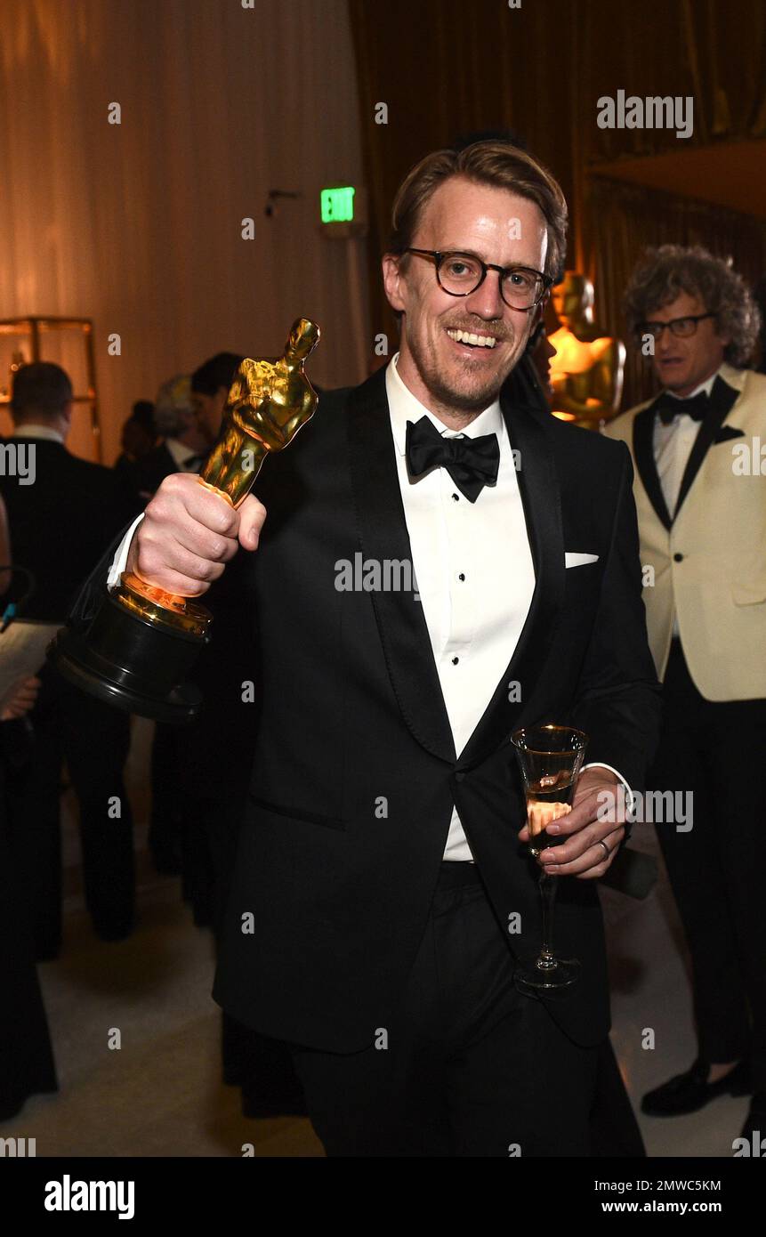 Andrew R. Jones poses with his award for best visual effects for "The ...