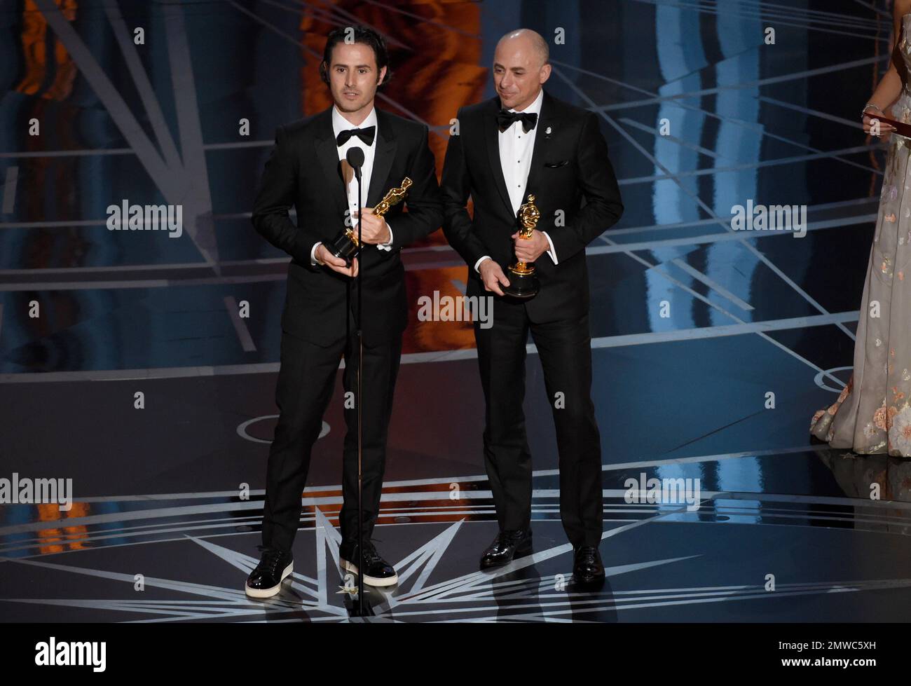 Alan Barillaro, left, and Marc Sondheimer accept the award for best ...
