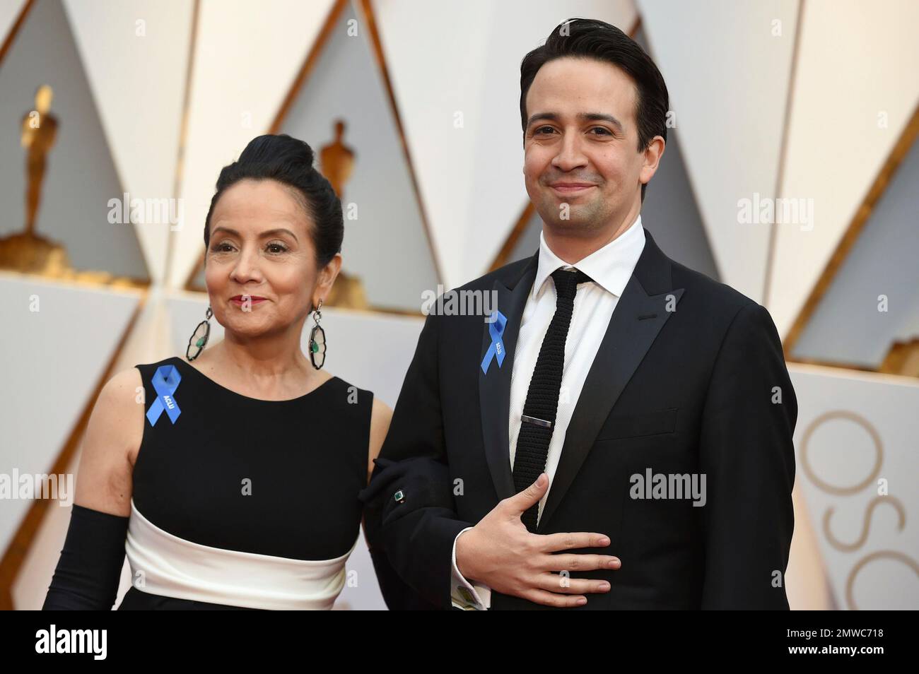 Luz Towns-Miranda, left, and Lin-Manuel Miranda arrive at the Oscars on ...