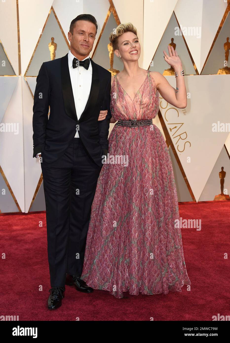 From left, Joe Machota and Scarlett Johansson arrive at the Oscars on ...