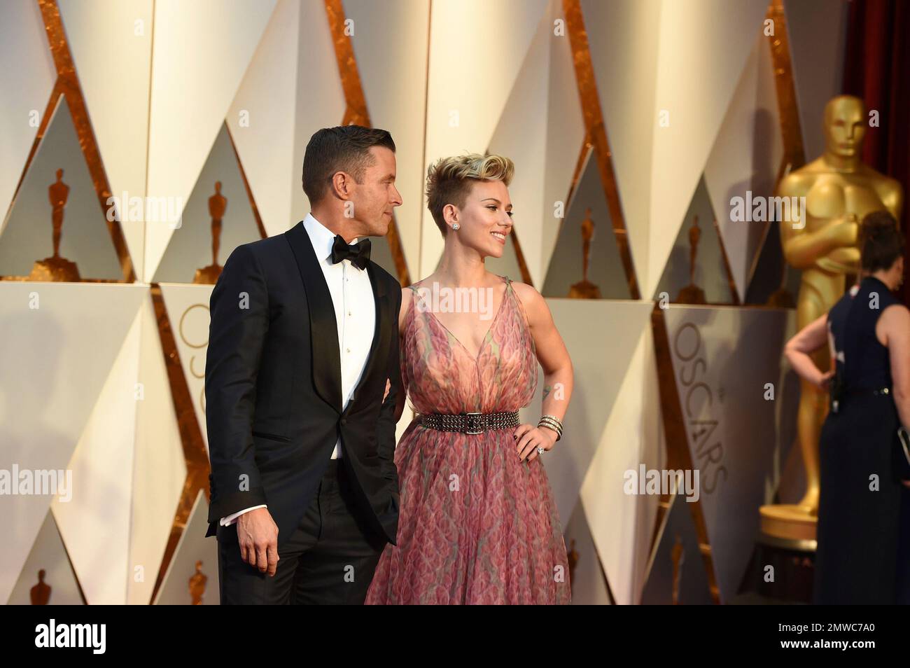 From left, Joe Machota and Scarlett Johansson arrive at the Oscars on ...