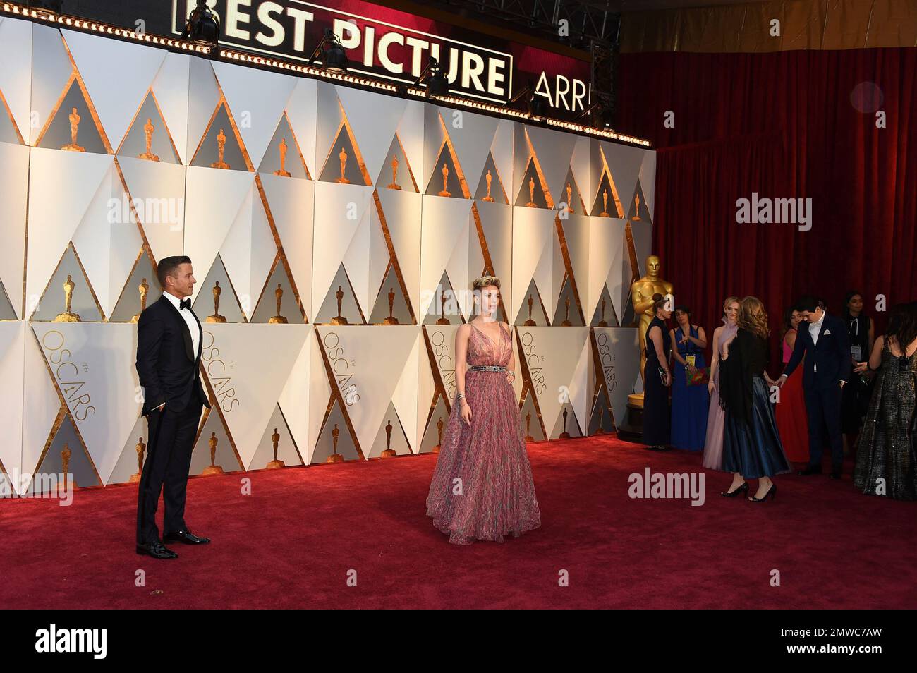 From left, Joe Machota and Scarlett Johansson arrive at the Oscars on ...