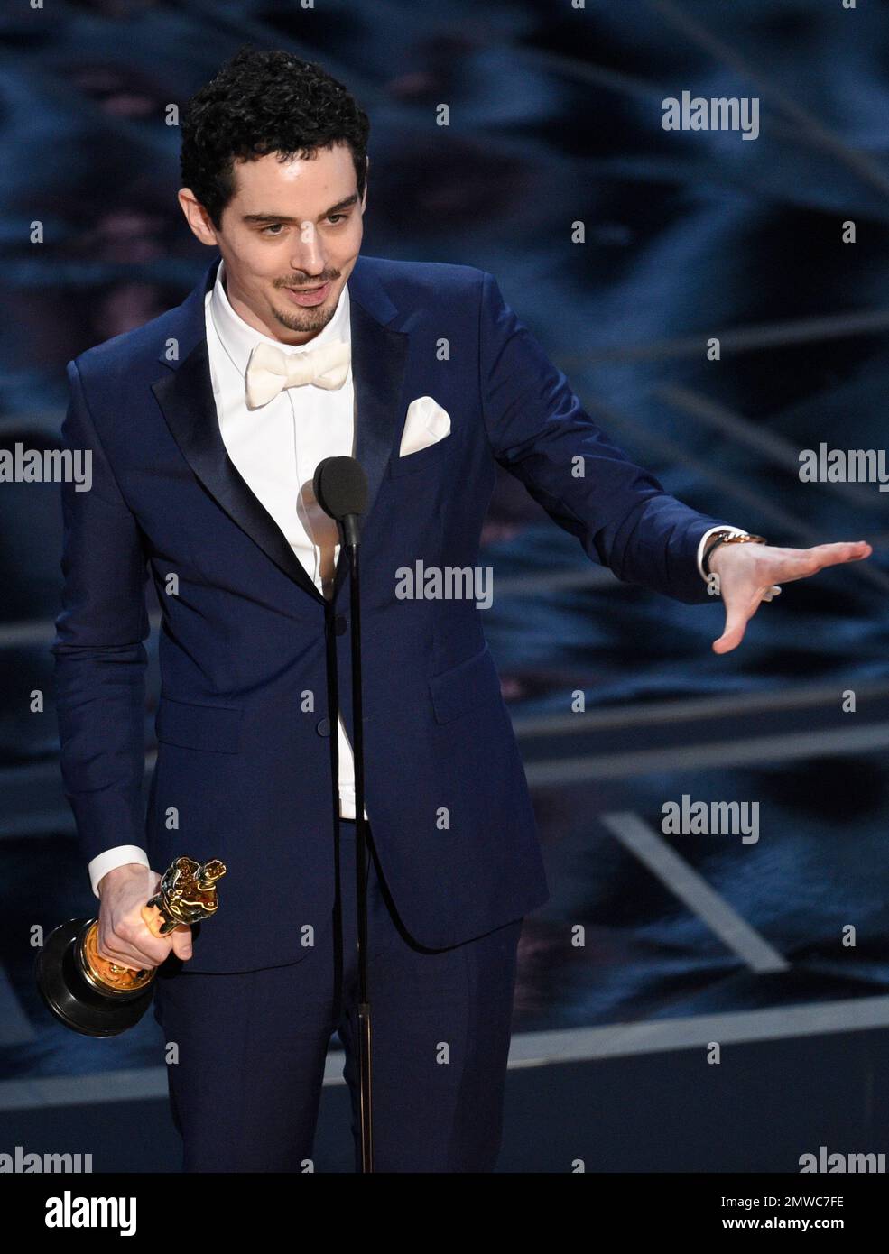 Damien Chazelle accepts the award for best director for "La La Land" at ...