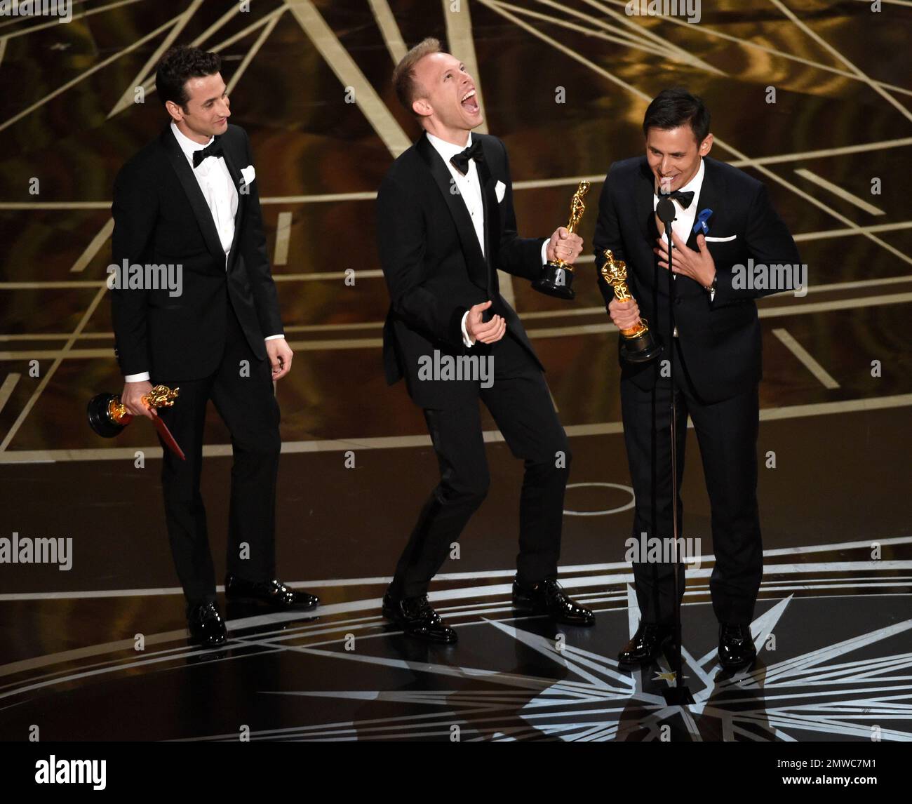 Justin Hurwitz, from left, Justin Paul, and Benj Pasek accept the award for best original song ...