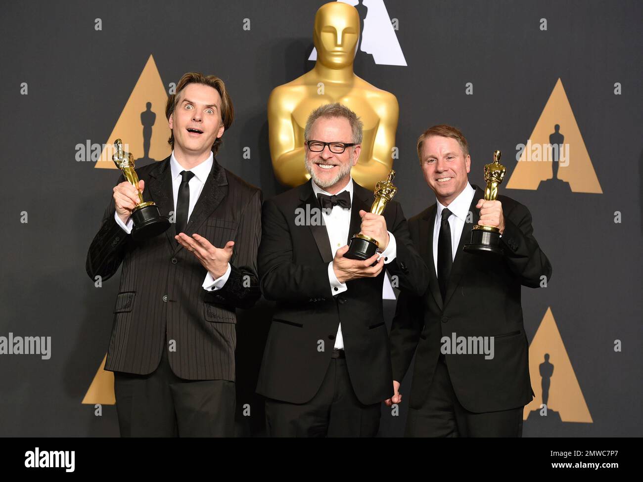 Byron Howard, from left, Rich Moore and Clark Spencer pose in the press ...