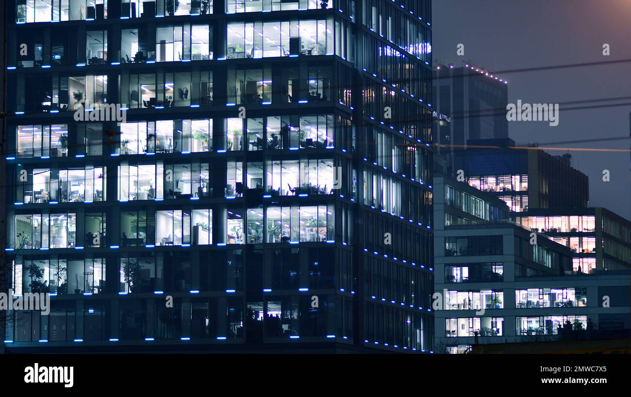 Corporate building at night - business concept. Glass wall office ...