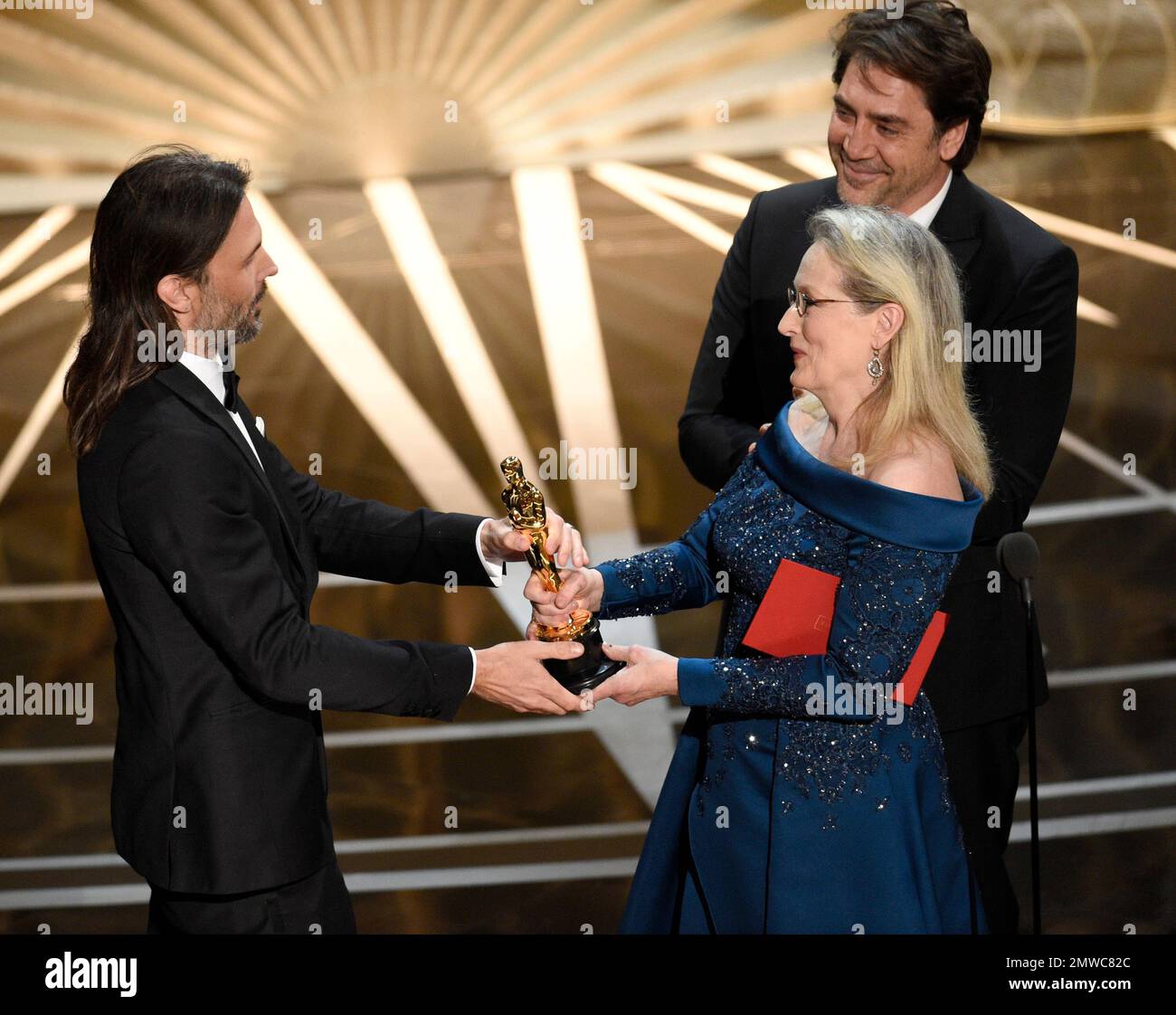 Javier Bardem, from right, and Meryl Streep present Linus Sandgren with ...