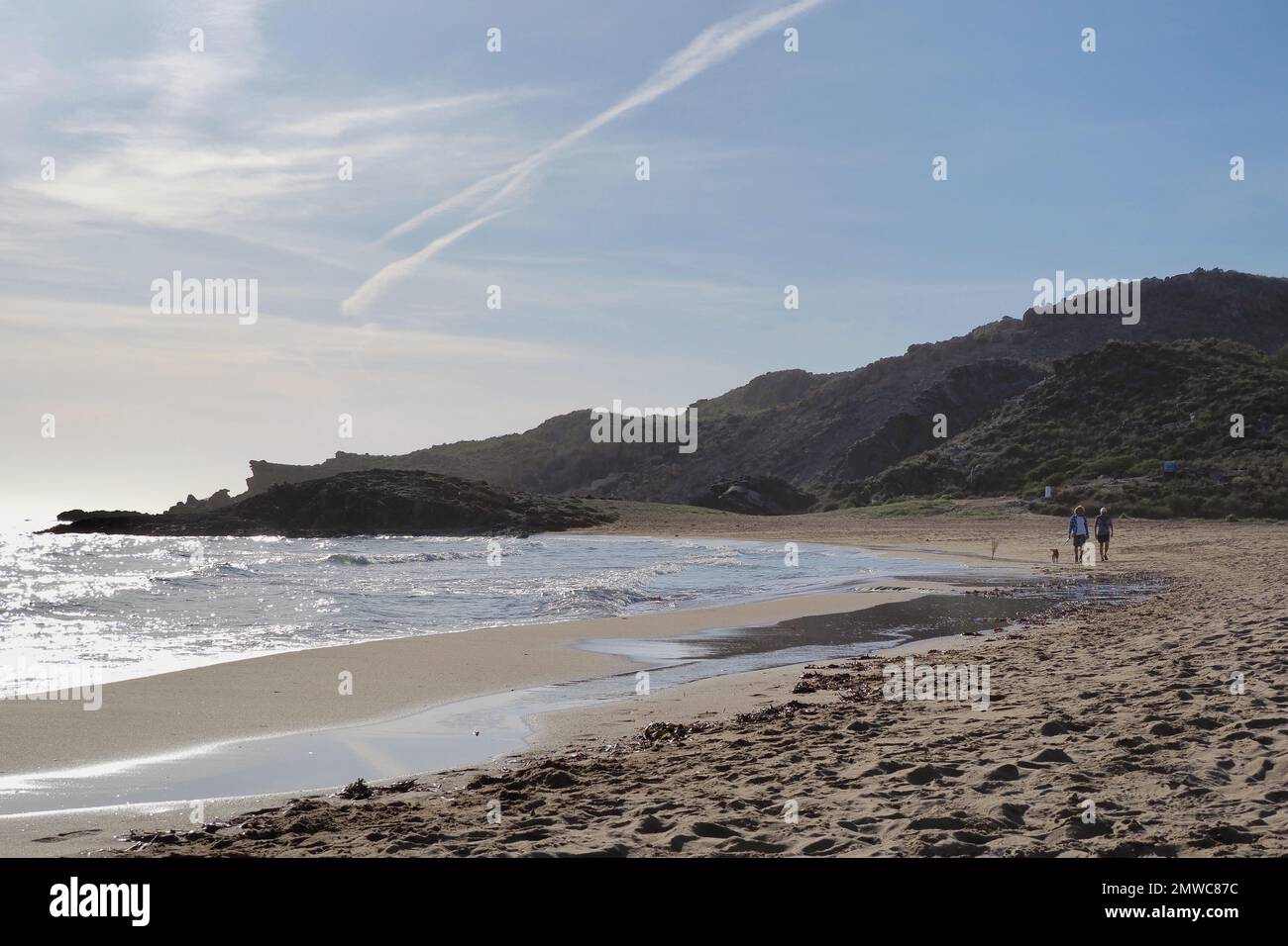 Snake Bay (Playa Percheles) near Mazarron with beach walkers, mountains ...
