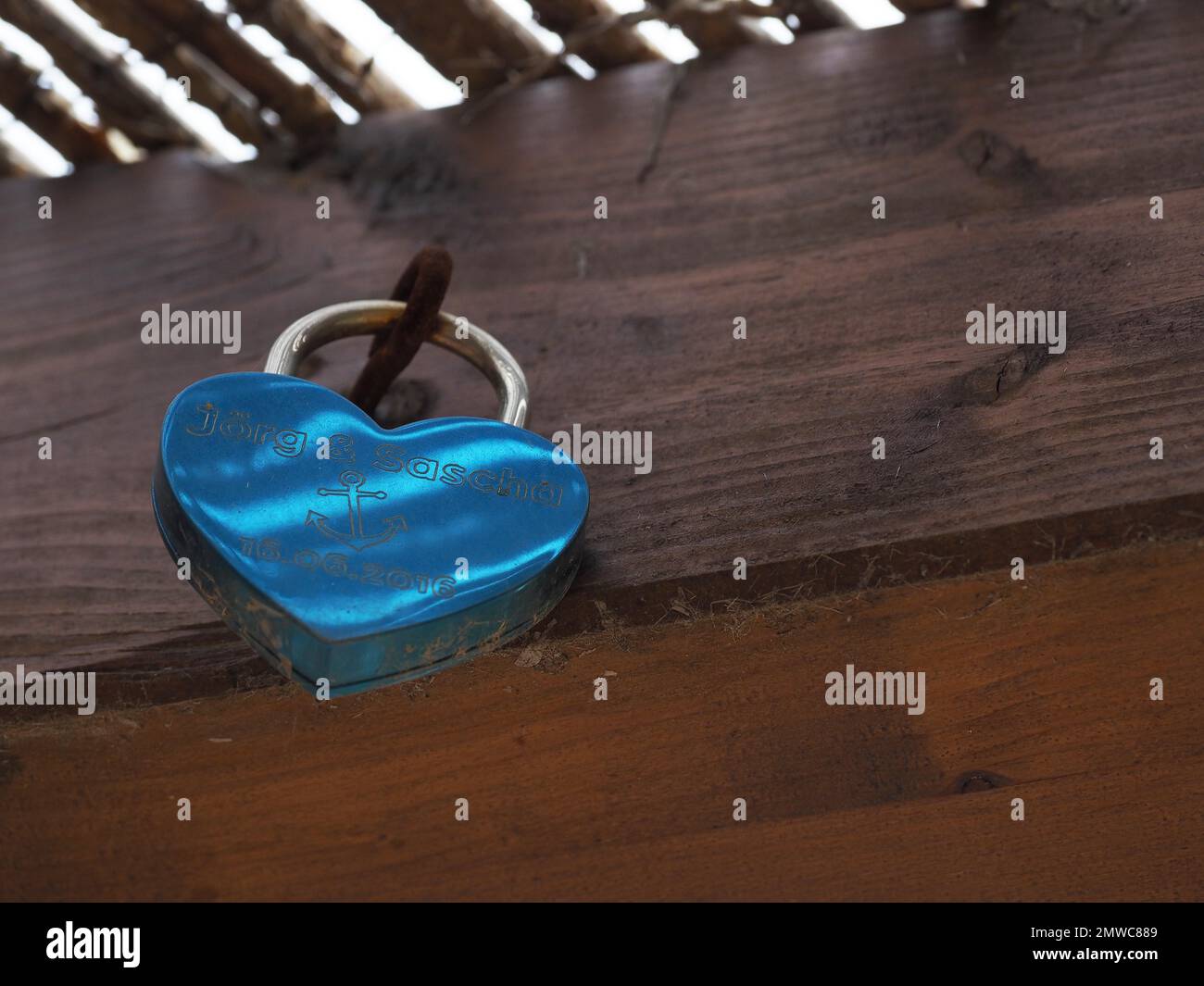 Love lock on wooden wall of gay couple Stock Photo - Alamy