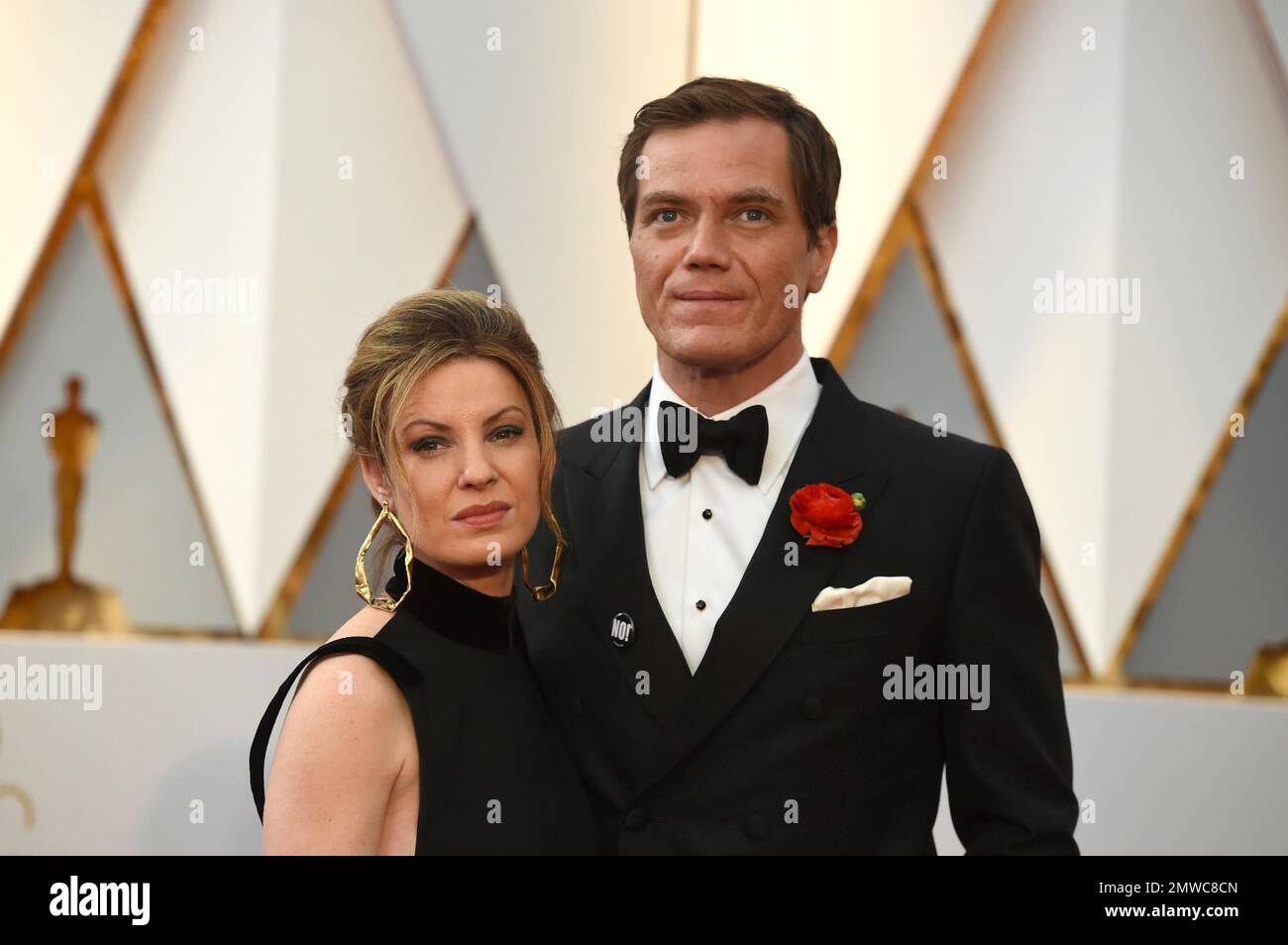 Kate Arrington, left, and Michael Shannon arrive at the Oscars on ...