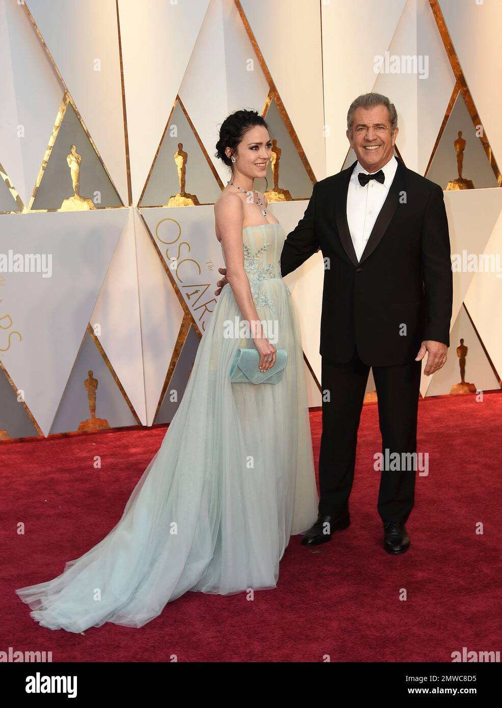 Rosalind Ross, left, and Mel Gibson arrive at the Oscars on Sunday, Feb ...
