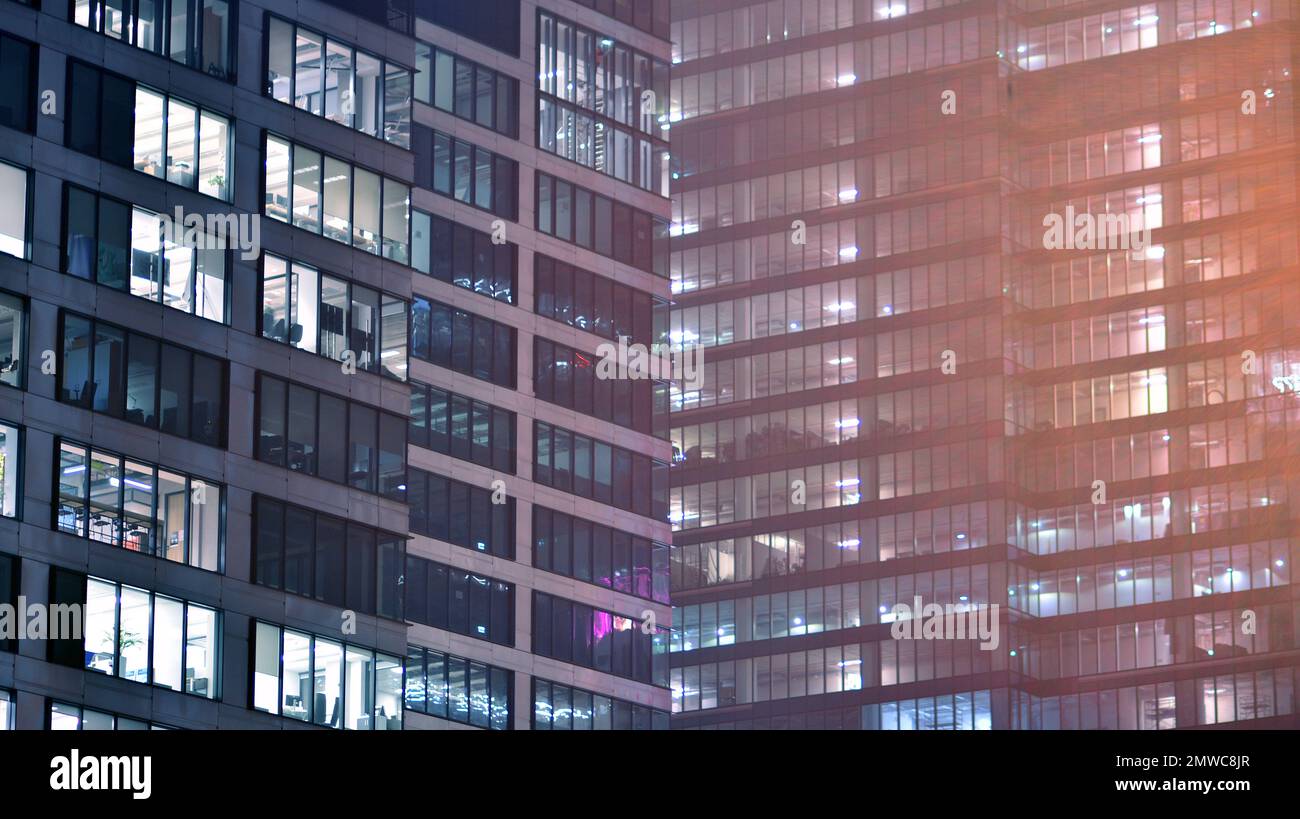 Corporate building at night - business concept. Glass wall office ...