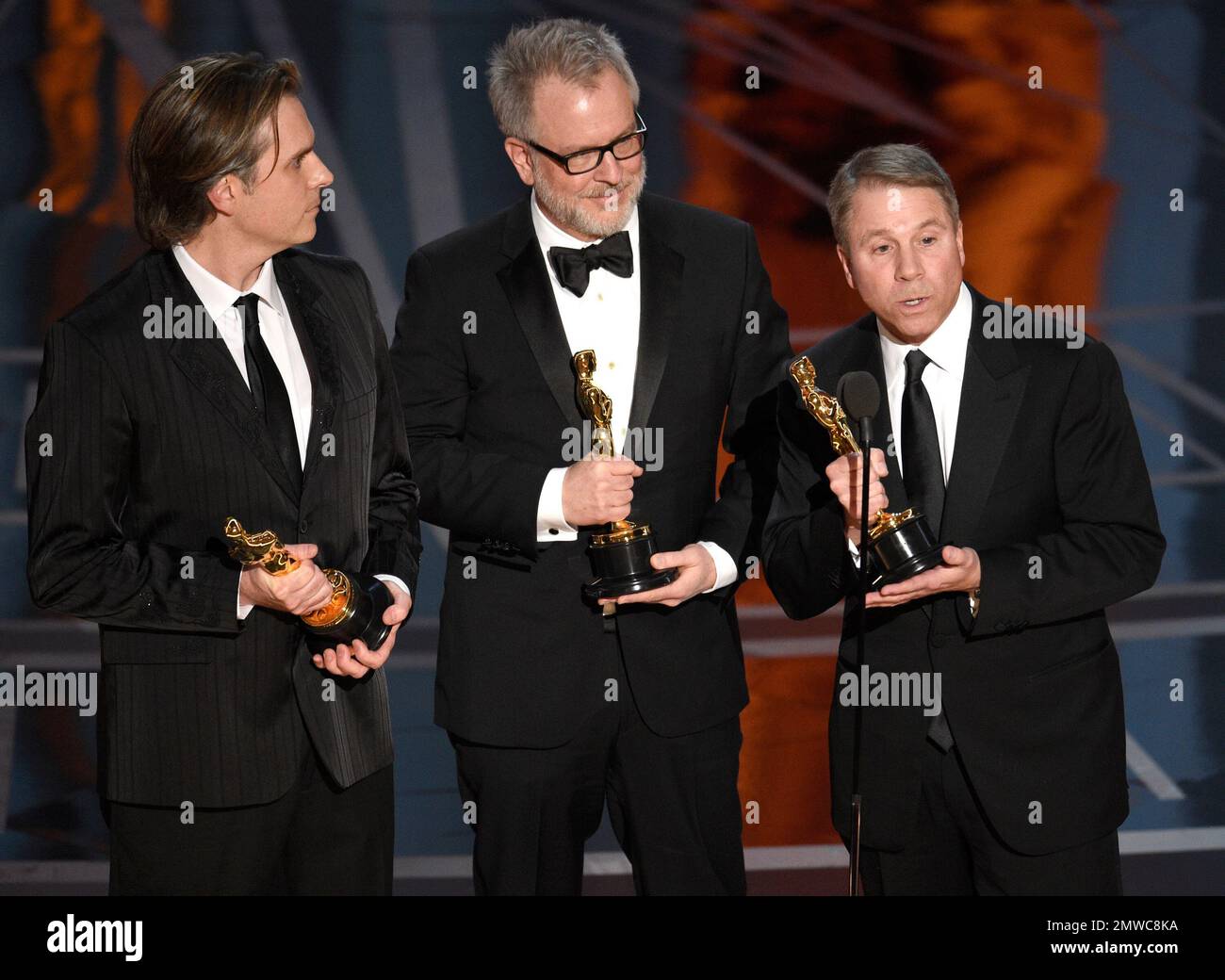 Byron Howard, from left, Rich Moore, and Clark Spencer accepts the ...