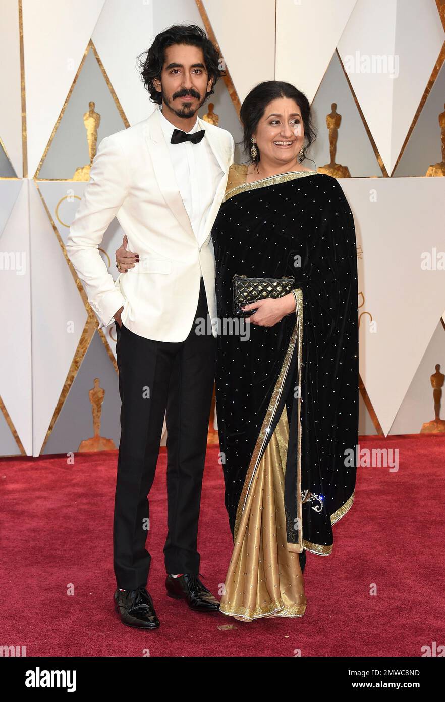 Dev Patel and his mother, Anita Patel, arrive at the Oscars on Sunday ...