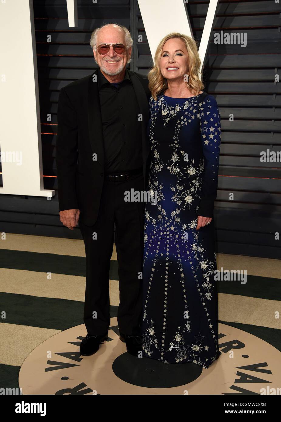 Jimmy Buffett, left, and Jane Slagsvol arrive at the Vanity Fair Oscar ...