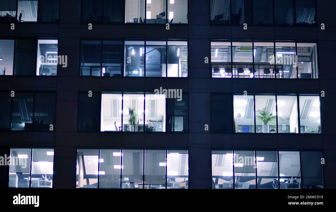 Corporate building at night - business concept. Glass wall office ...