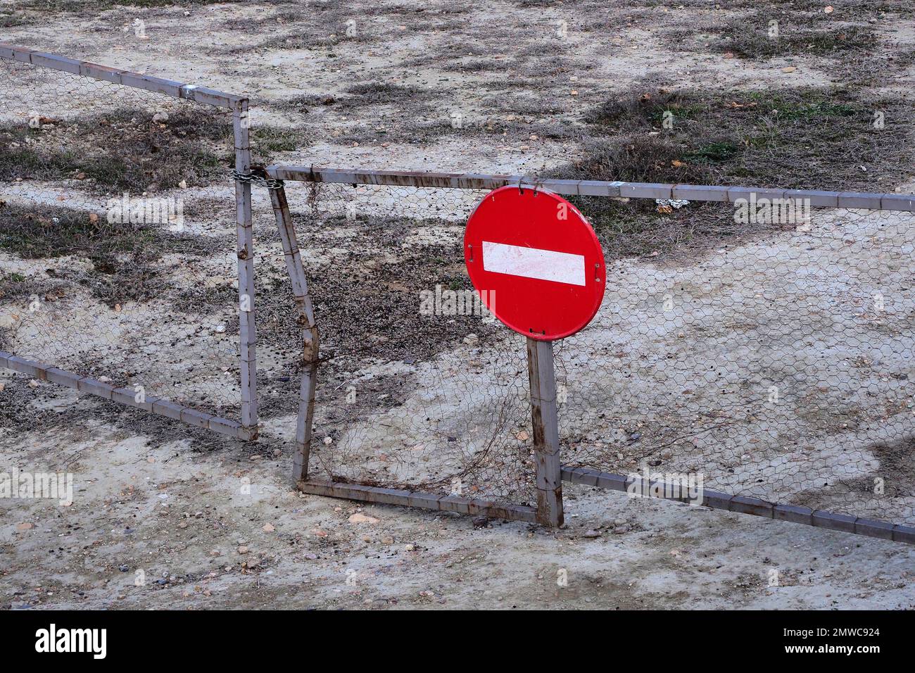 Entrance gate, fence and traffic sign Entry prohibited Stock Photo - Alamy