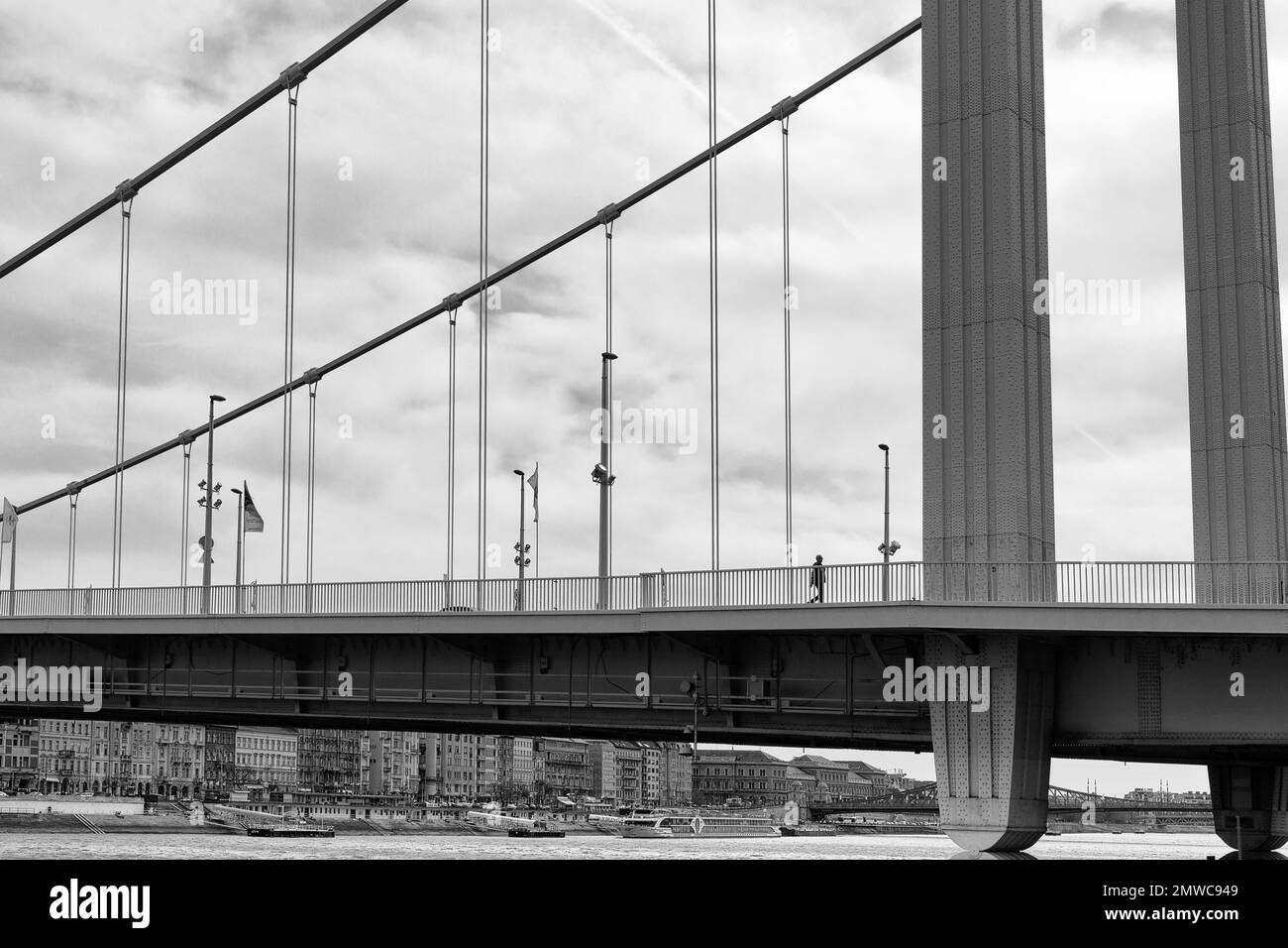 Pedestrian walking over steel suspension bridge, Elisabeth Bridge ... Pedestrian walking over steel suspension bridge, Elisabeth Bridge ...