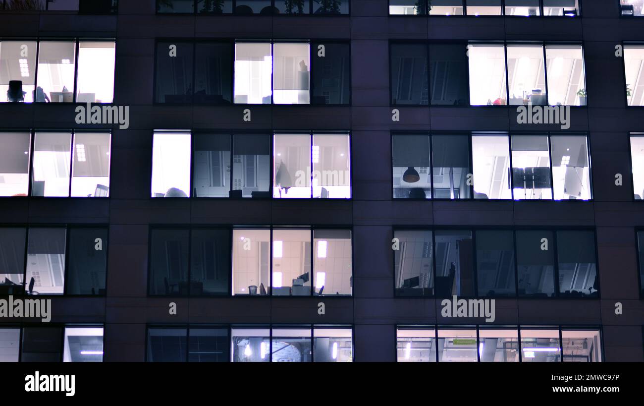 Corporate building at night - business concept. Glass wall office ...