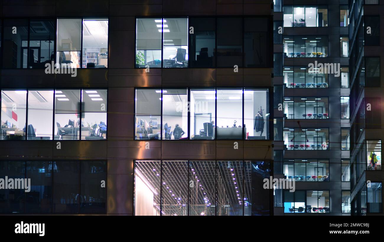 Corporate building at night - business concept. Glass wall office ...
