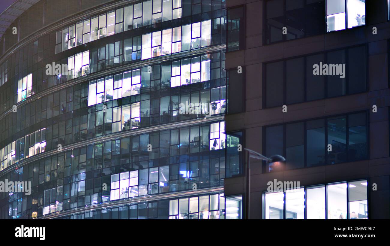 Corporate building at night - business concept. Glass wall office ...