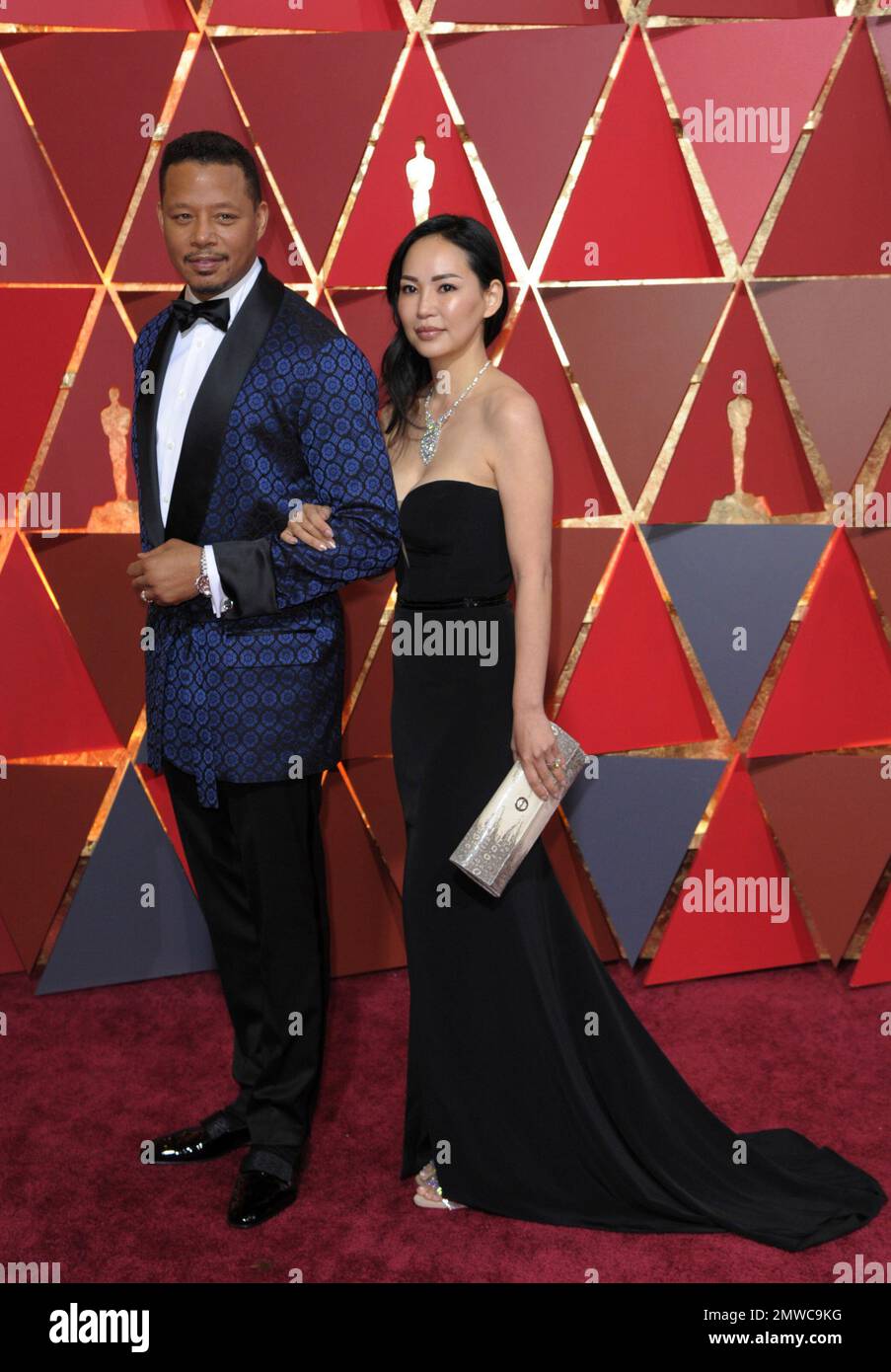 Terrence Howard, left, and Miranda Pak arrive at the Oscars on Sunday ...