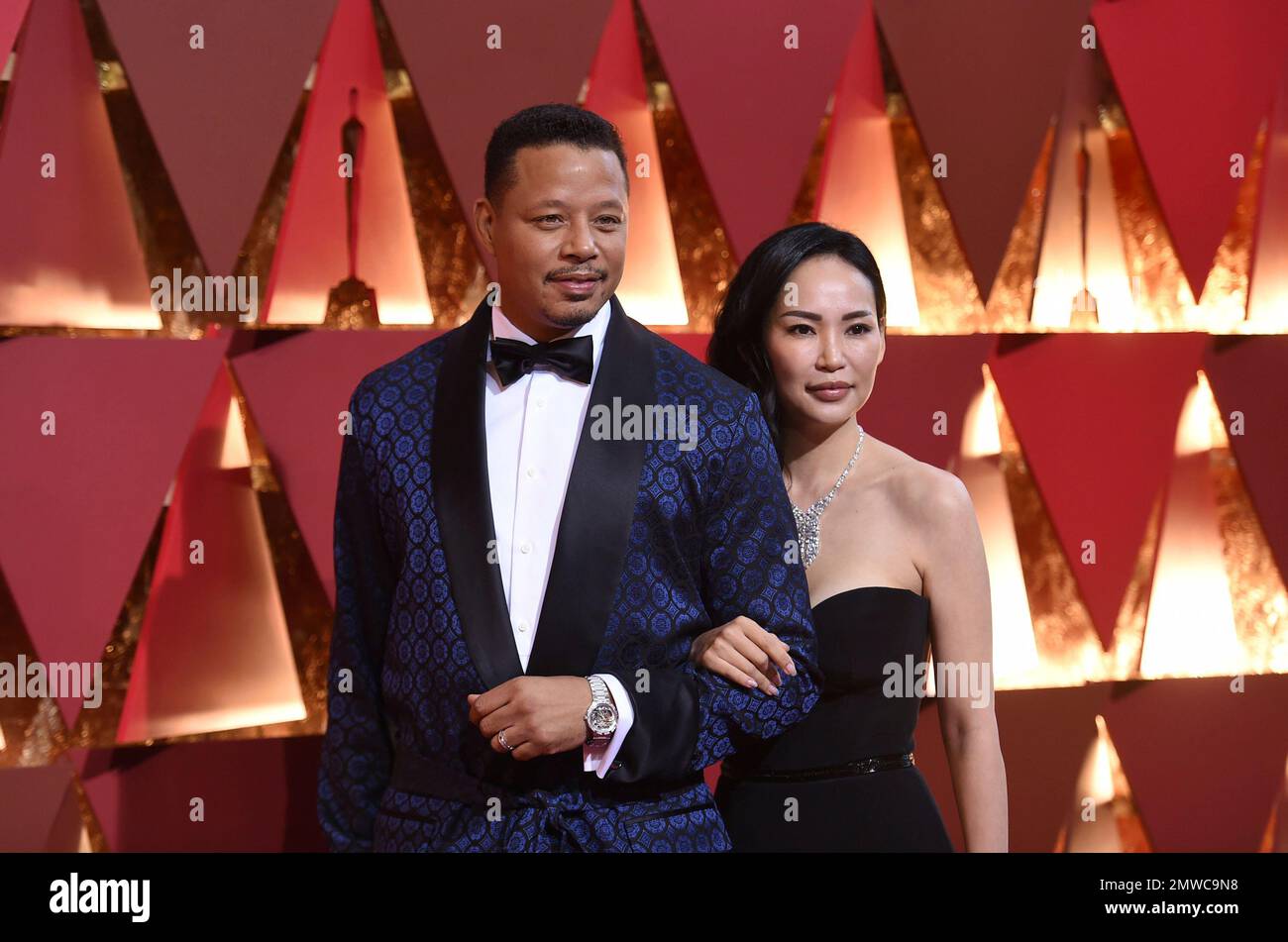 Terrence Howard, left, and Miranda Pak arrive at the Oscars on Sunday ...